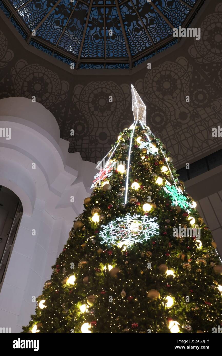 Standing Christmas tree high up on top Stock Photo - Alamy