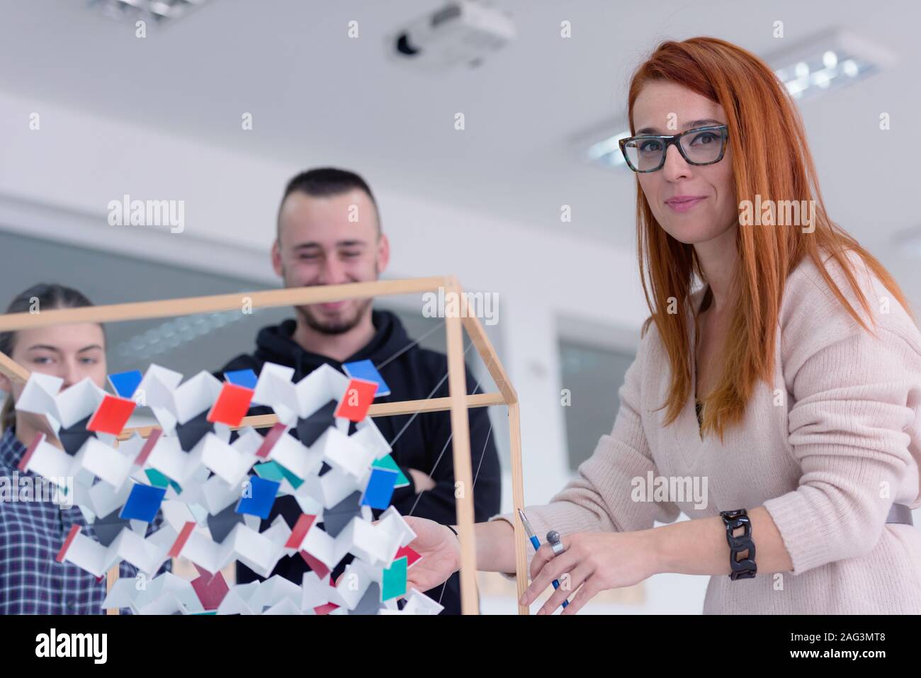 Female Architecture teacher at work. Female professor explain ...