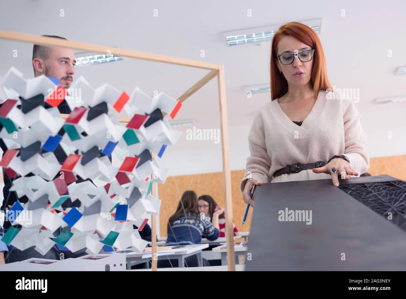 Female Architecture teacher at work. Female professor explain ...