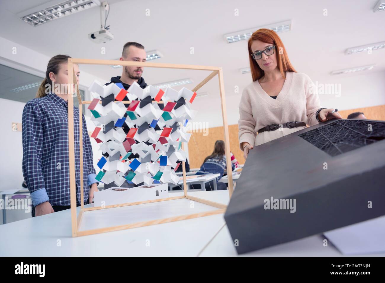 Female Architecture teacher at work. Female professor explain ...