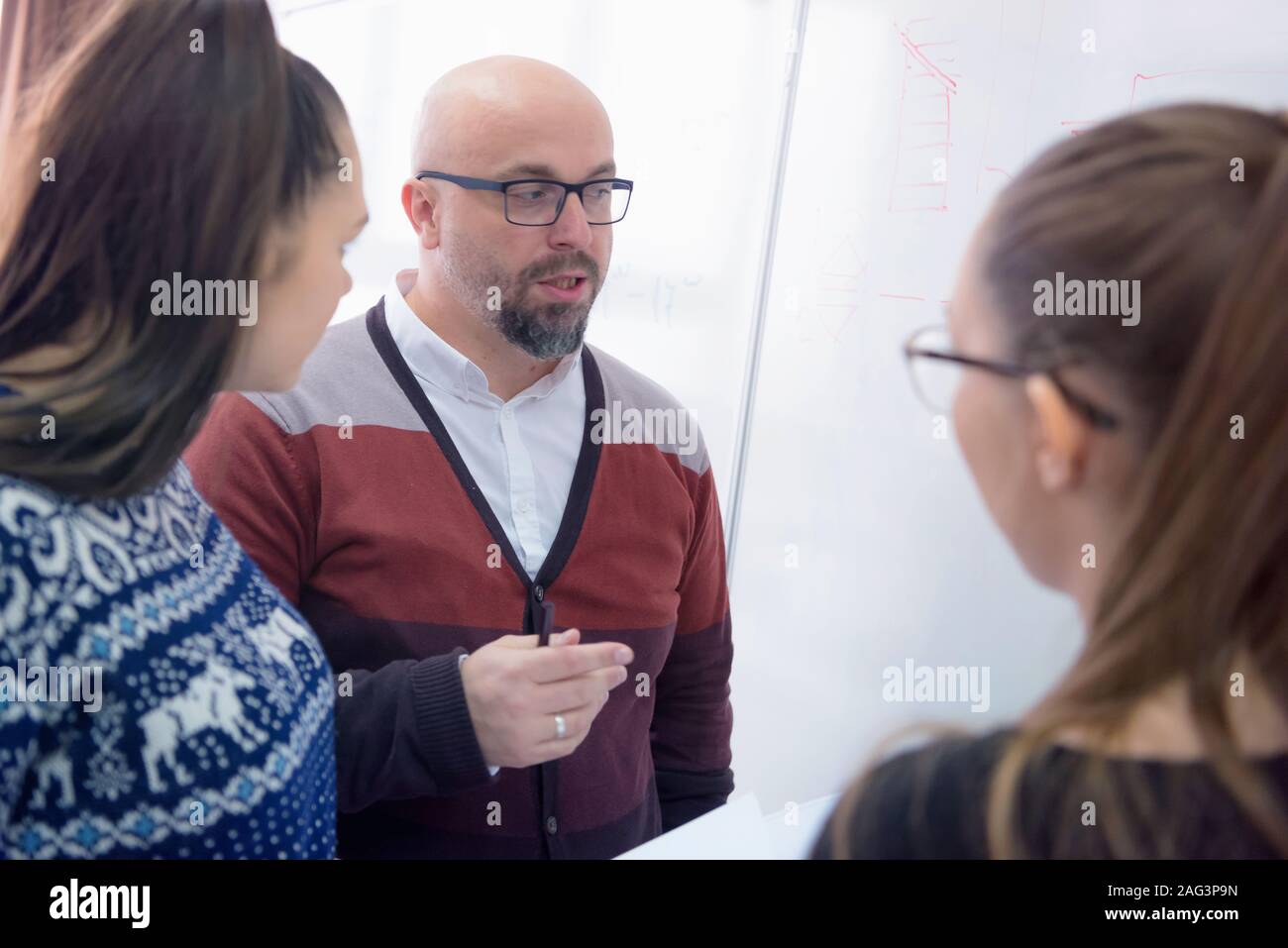 Male professor of architecture explain lesson to multiethnic students ...