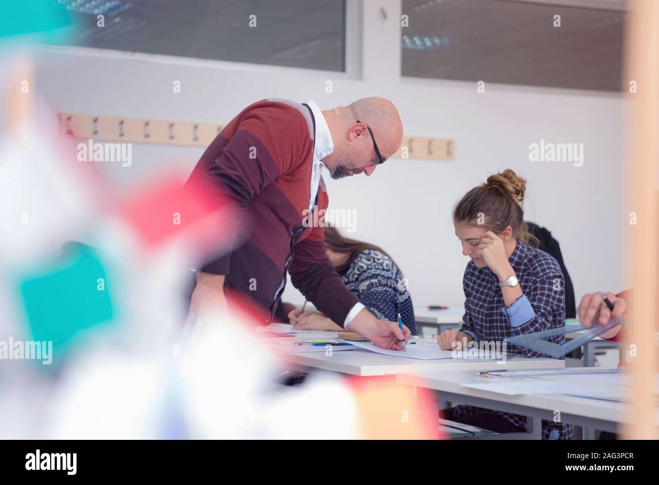 Male professor of architecture explain lesson to multiethnic students ...