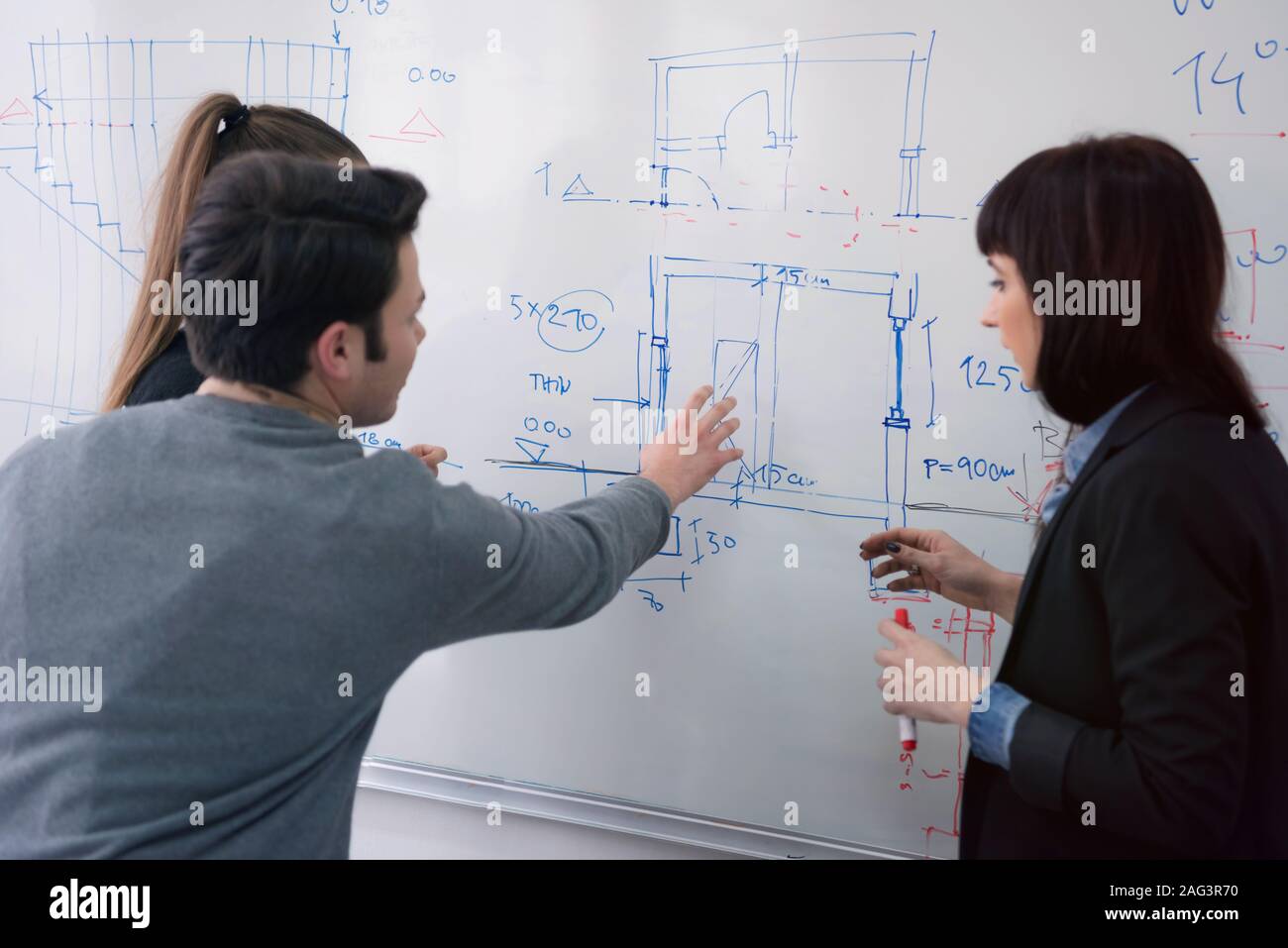 Female Architecture teacher at work. Female professor explain ...