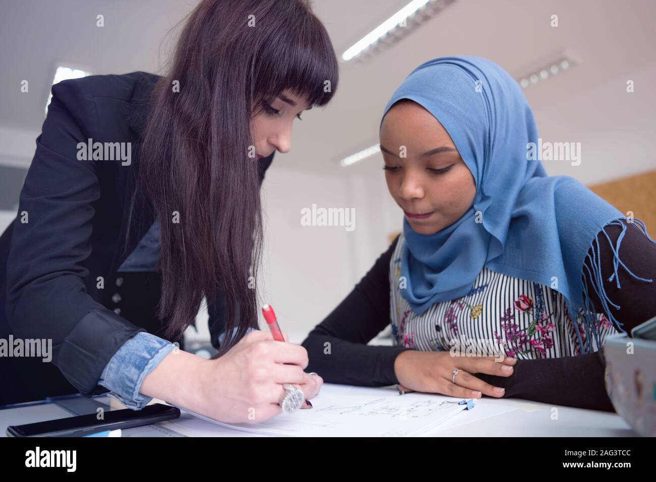 Female Architecture teacher at work. Female professor explain ...