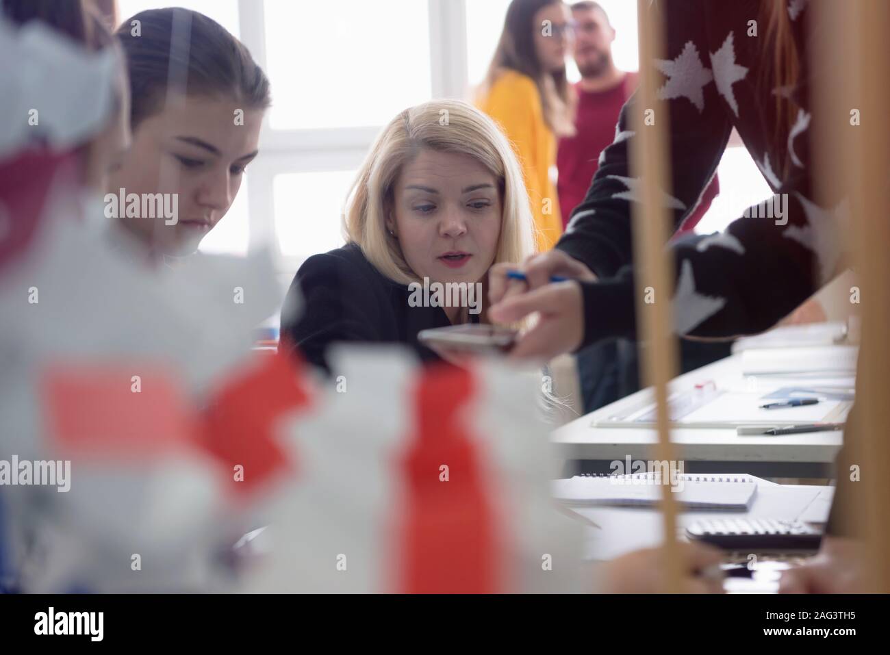 Female Architecture teacher at work. Female professor explain ...
