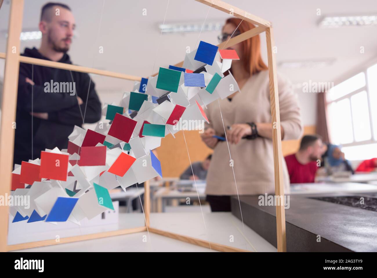 Female Architecture teacher at work. Female professor explain ...