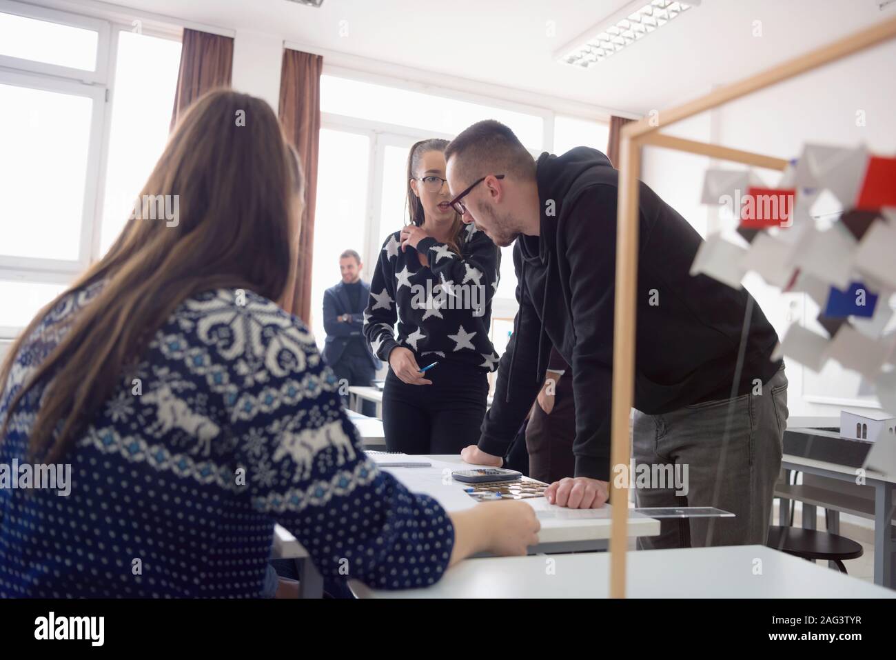 Female Architecture teacher at work. Female professor explain ...