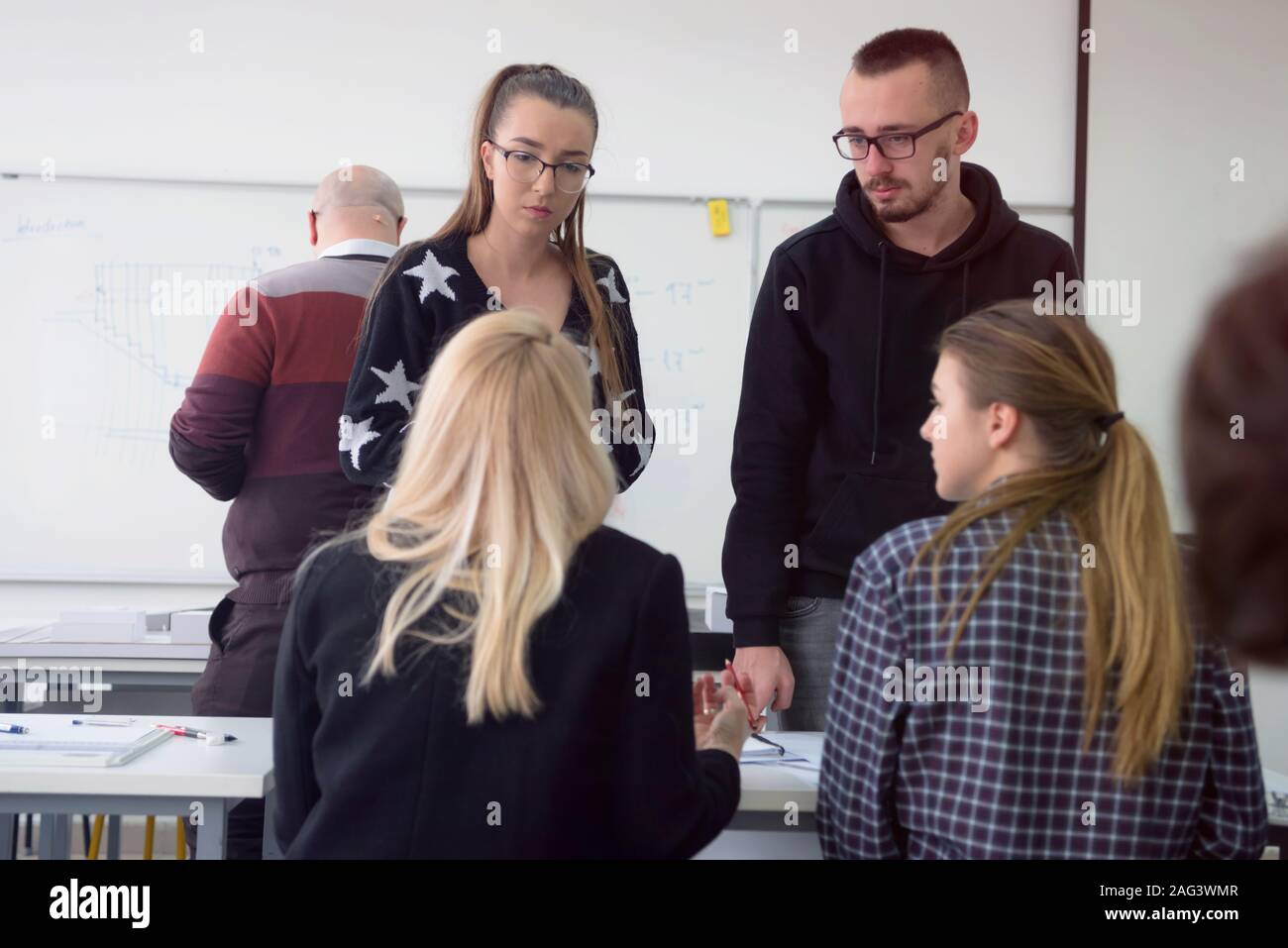 Female Architecture teacher at work. Female professor explain ...