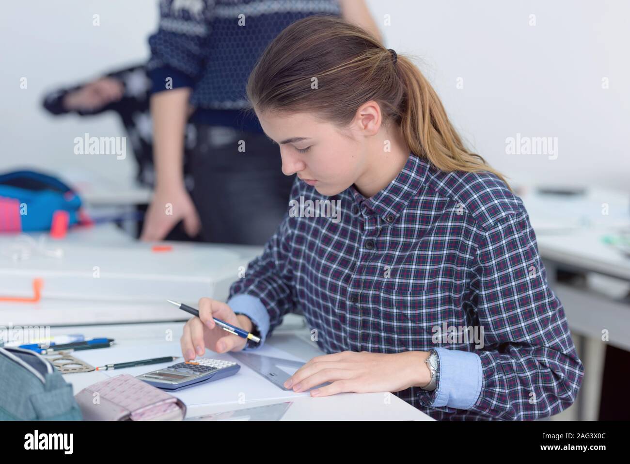 Female university architecture student working on practice lessons ...