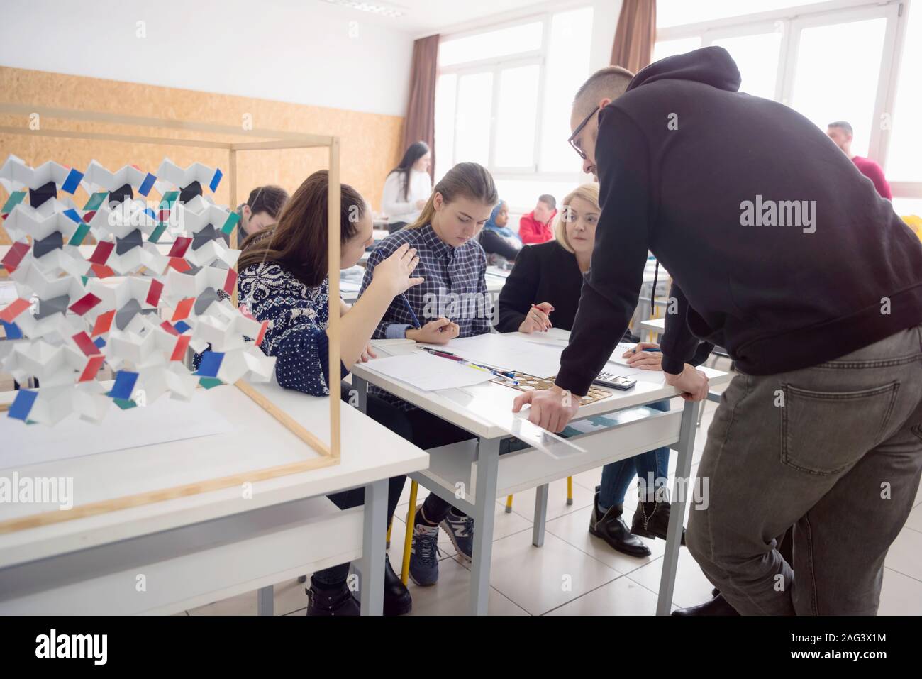 Female Architecture teacher at work. Female professor explain ...