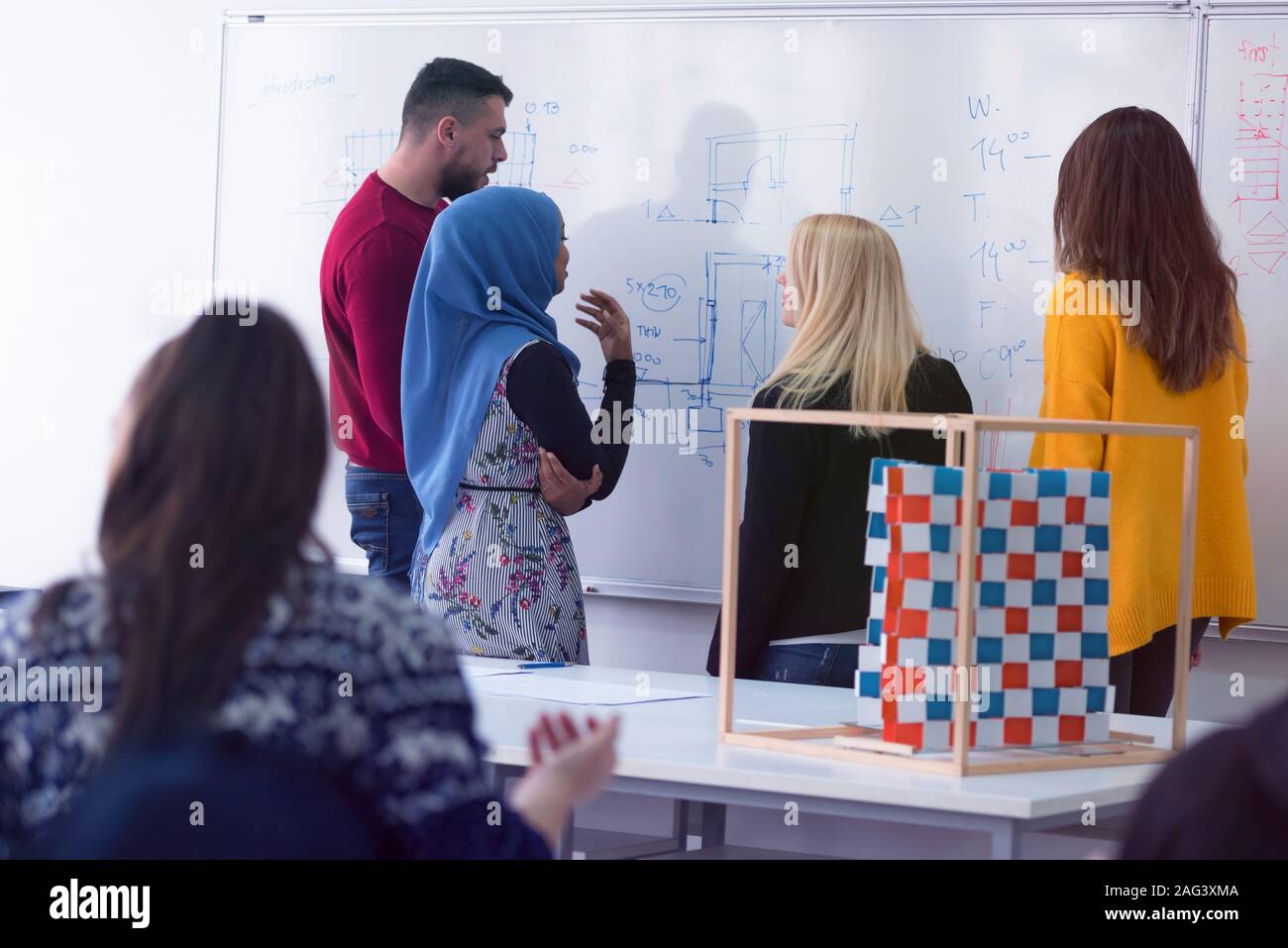 Female Architecture teacher at work. Female professor explain ...