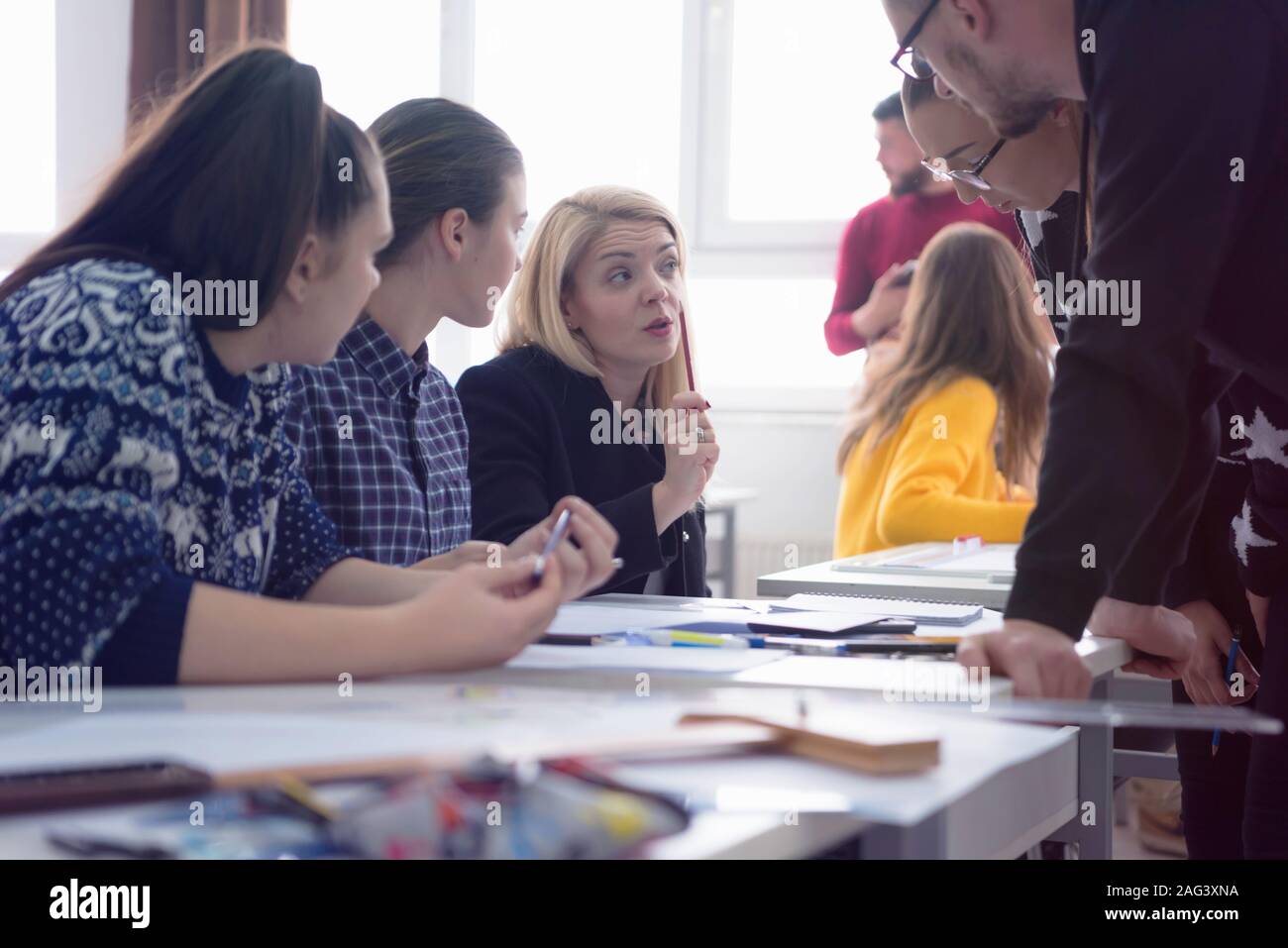 Female Architecture teacher at work. Female professor explain ...