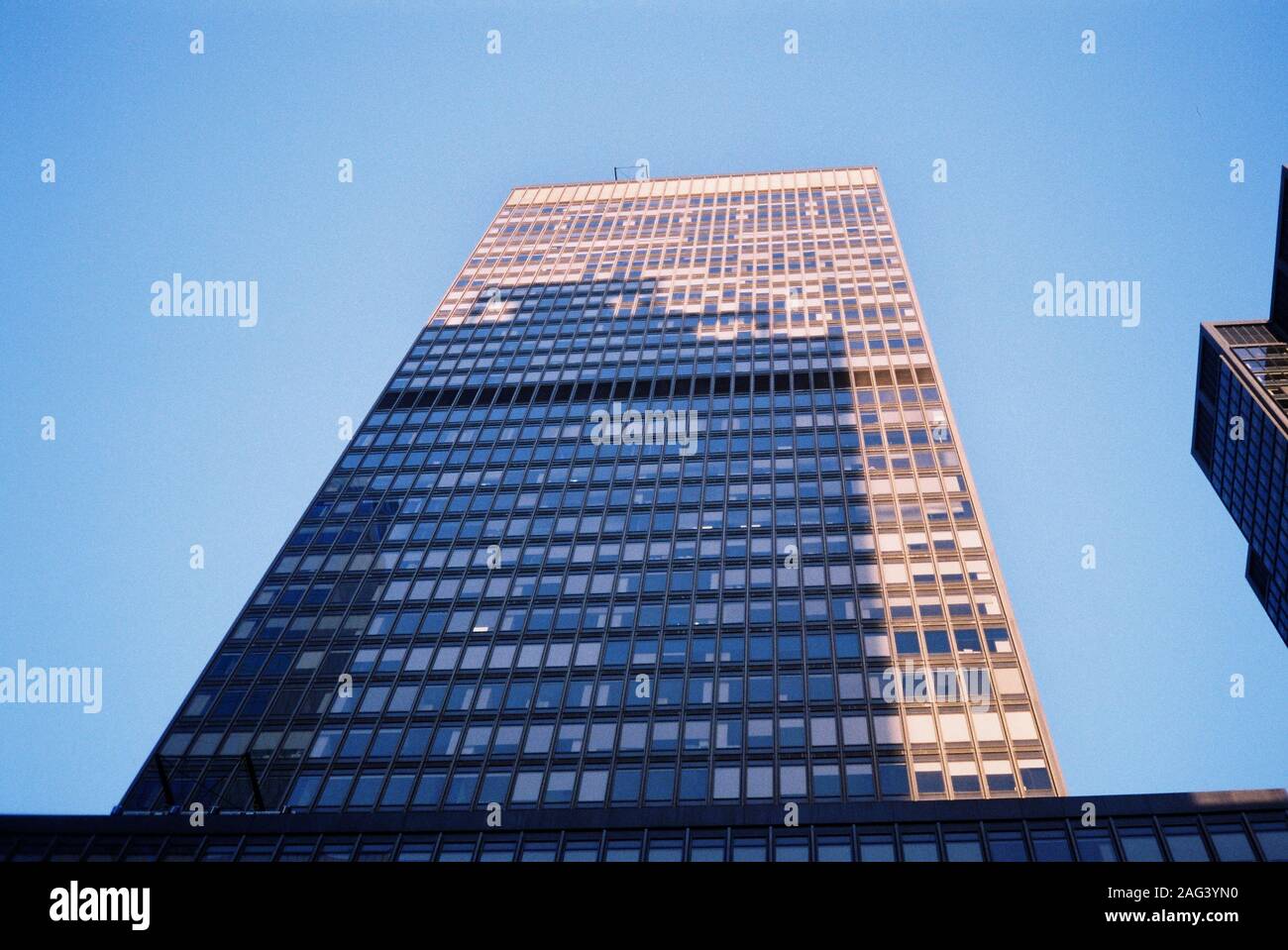 Low angle shot of a high rise building with see-through windows under ...