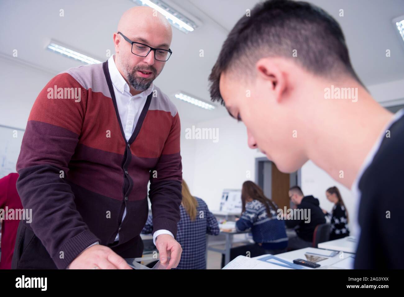 Male Professor Holding Lecture to Multi Ethnic Group of Students. Smart ...