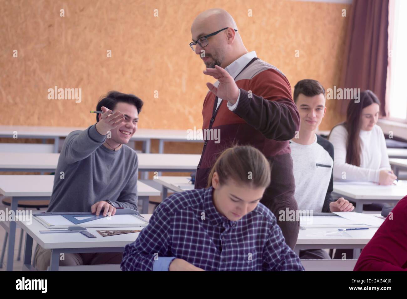 Male Professor Holding Lecture to Multi Ethnic Group of Students. Smart ...