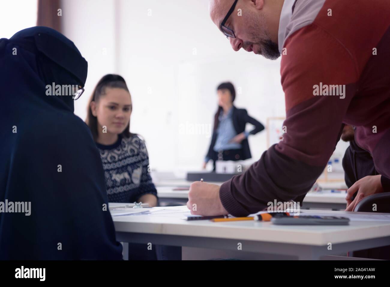 Male Professor Holding Lecture to Multi Ethnic Group of Students. Smart ...