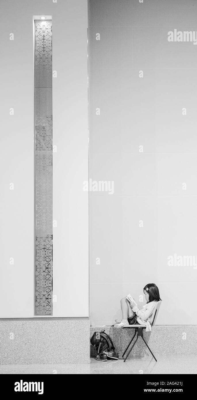 Vertical gray scale shot of a child reading a book Stock Photo - Alamy