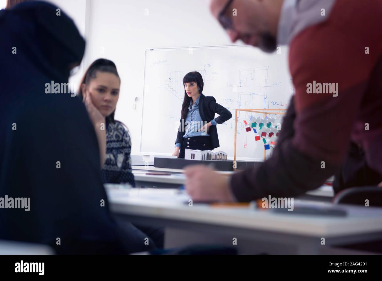 Male Professor Holding Lecture to Multi Ethnic Group of Students. Smart ...