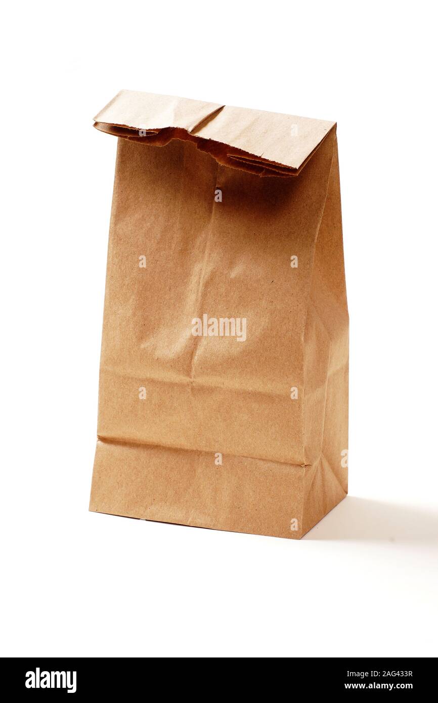 Blank paper bag folded closed at the top, isolated on white Stock Photo ...