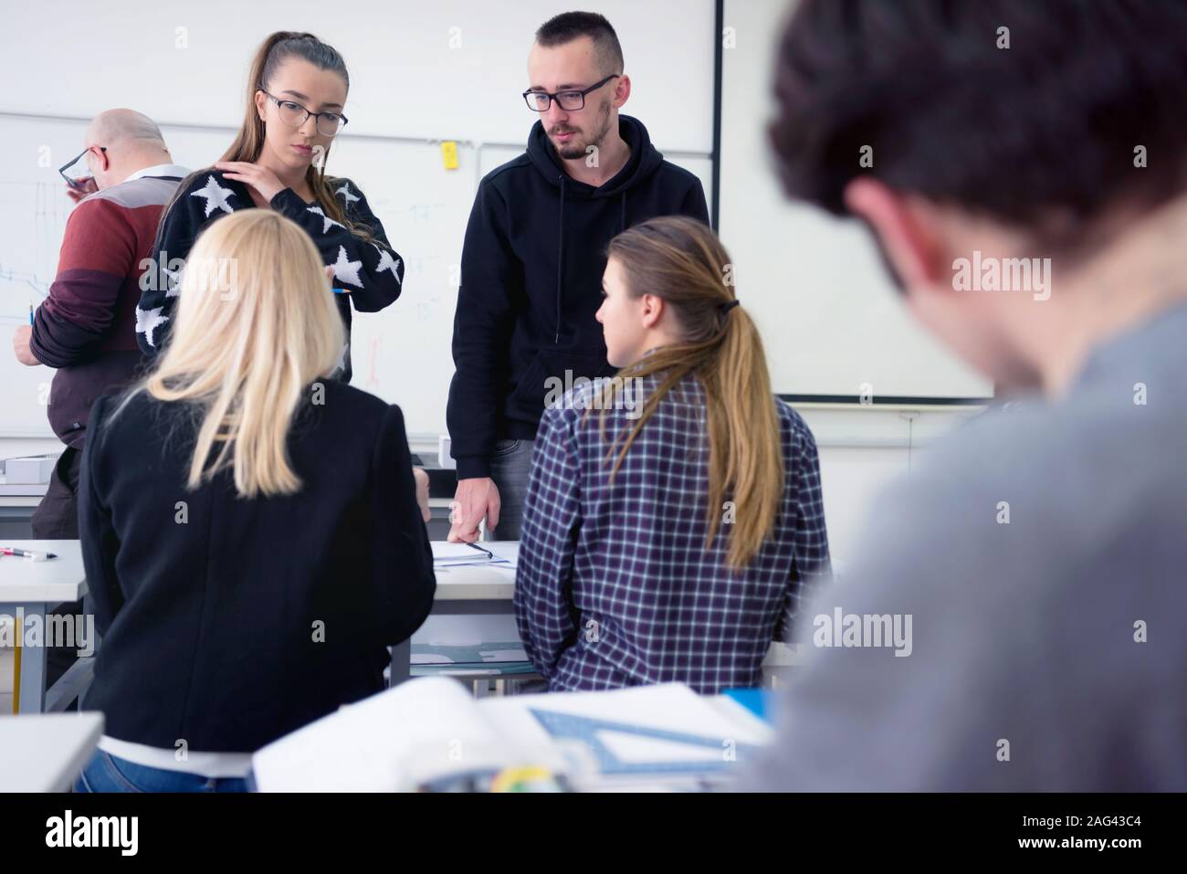 Female Professor Holding Lecture to Multi Ethnic Group of Students ...
