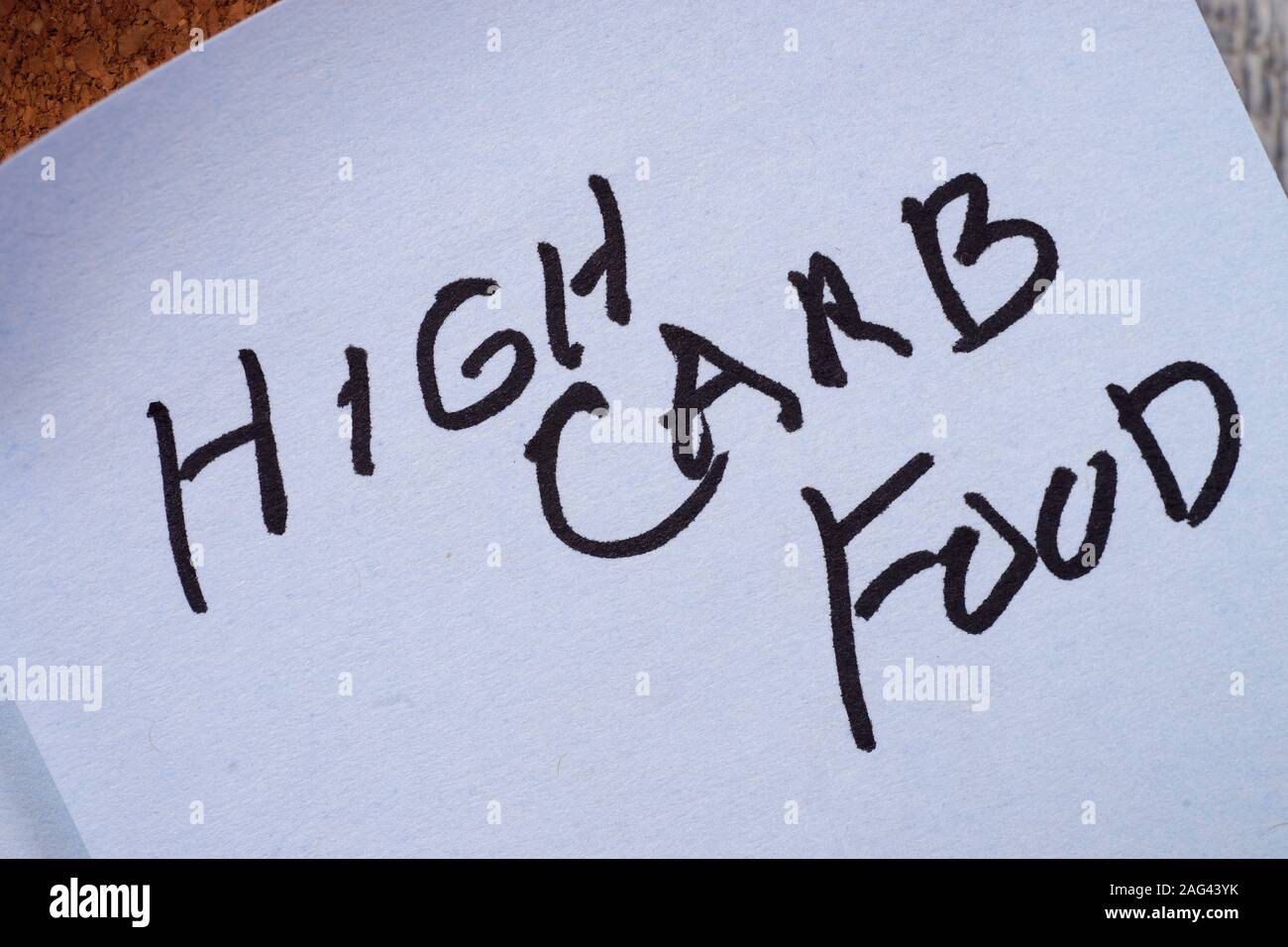 Sticky note with hand printed text about food and diet: HIGH CARB FOOD ...