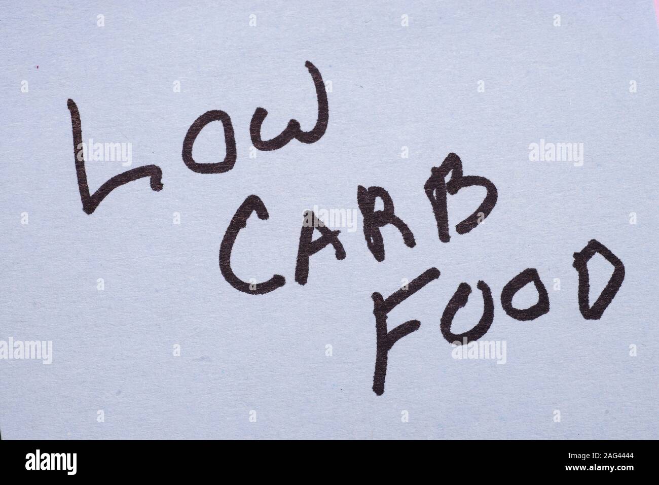 Sticky note with hand printed text about food and diet: LOW CARB FOOD ...