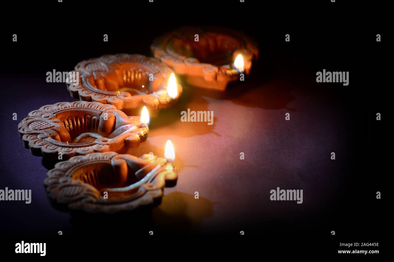Clay diya lamps lit during diwali celebration. Greetings Card Design ...