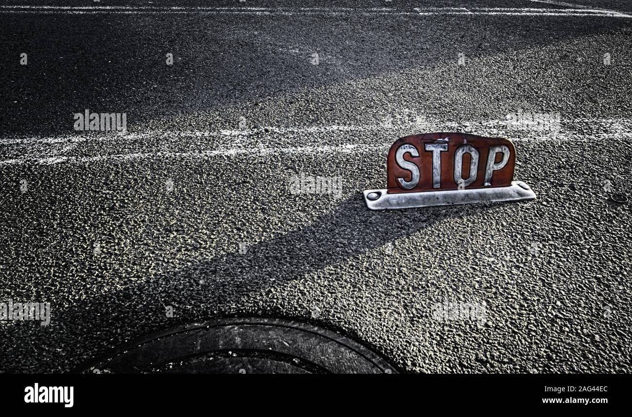 Closeup shot of a red stop sign in the middle of the road during ...