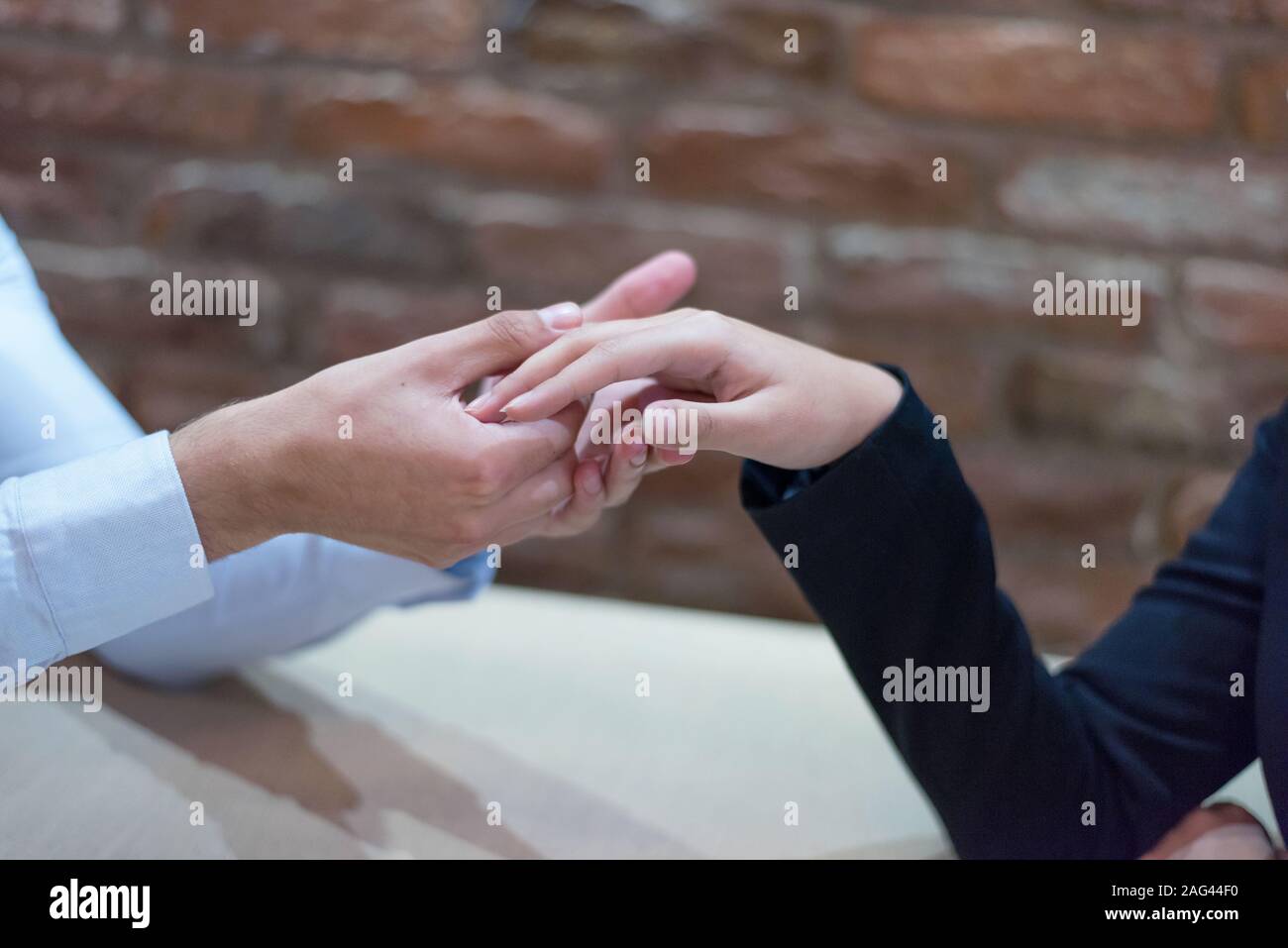 Giving of wedding ring. Man giving an engagement ring to his girlfriend ...