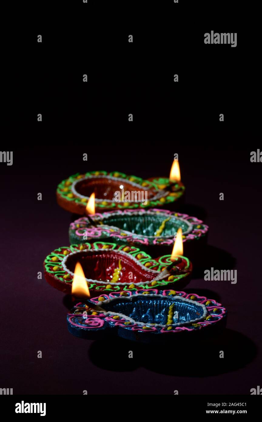 Clay diya lamps lit during diwali celebration. Greetings Card Design ...