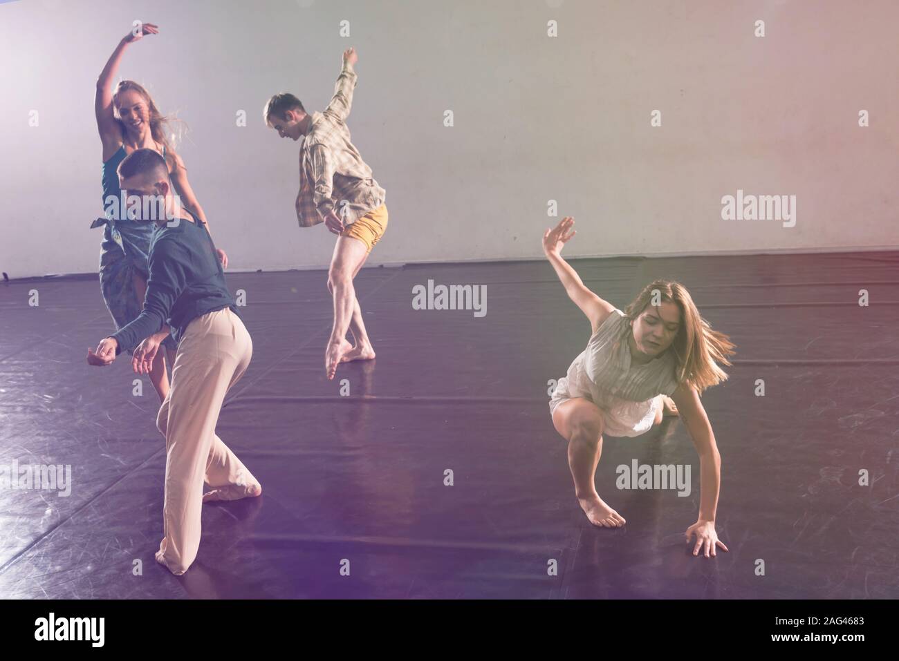 Young modern dancers dancing in the studio. Sport, dancing and urban ...
