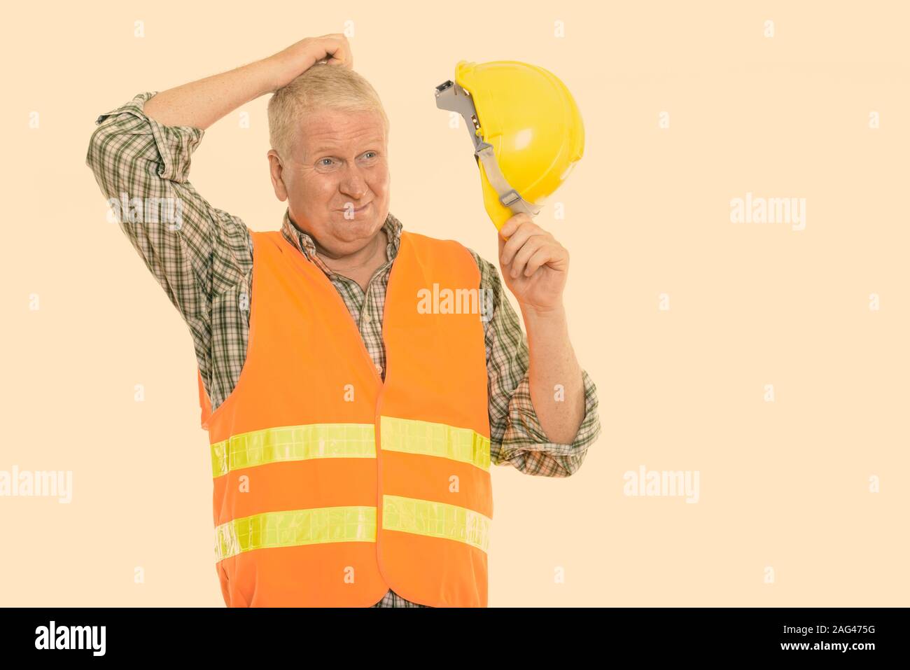 Builder scratching head hi-res stock photography and images - Alamy
