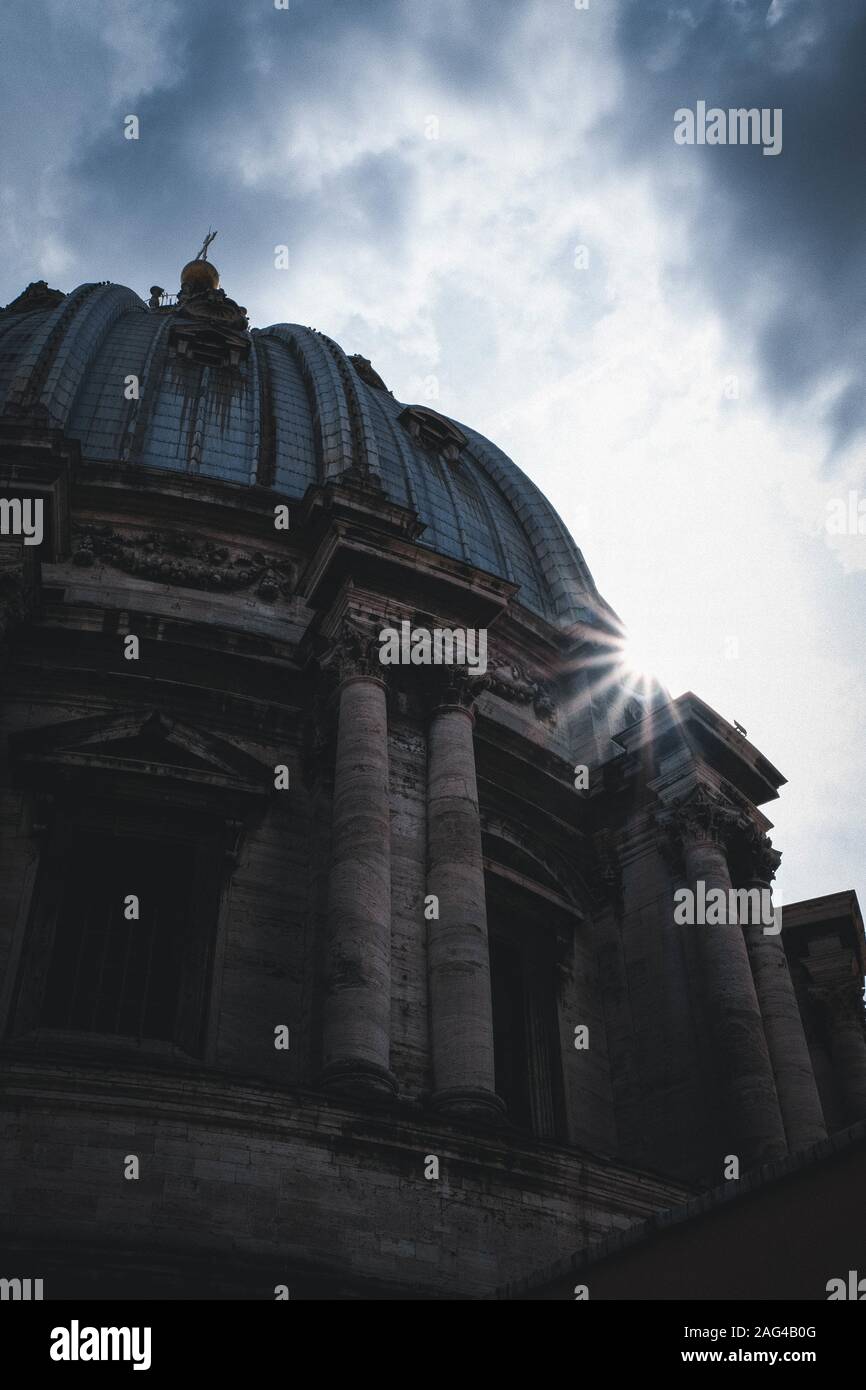 Vertical low angle shot of a temple with a round dome under the ...