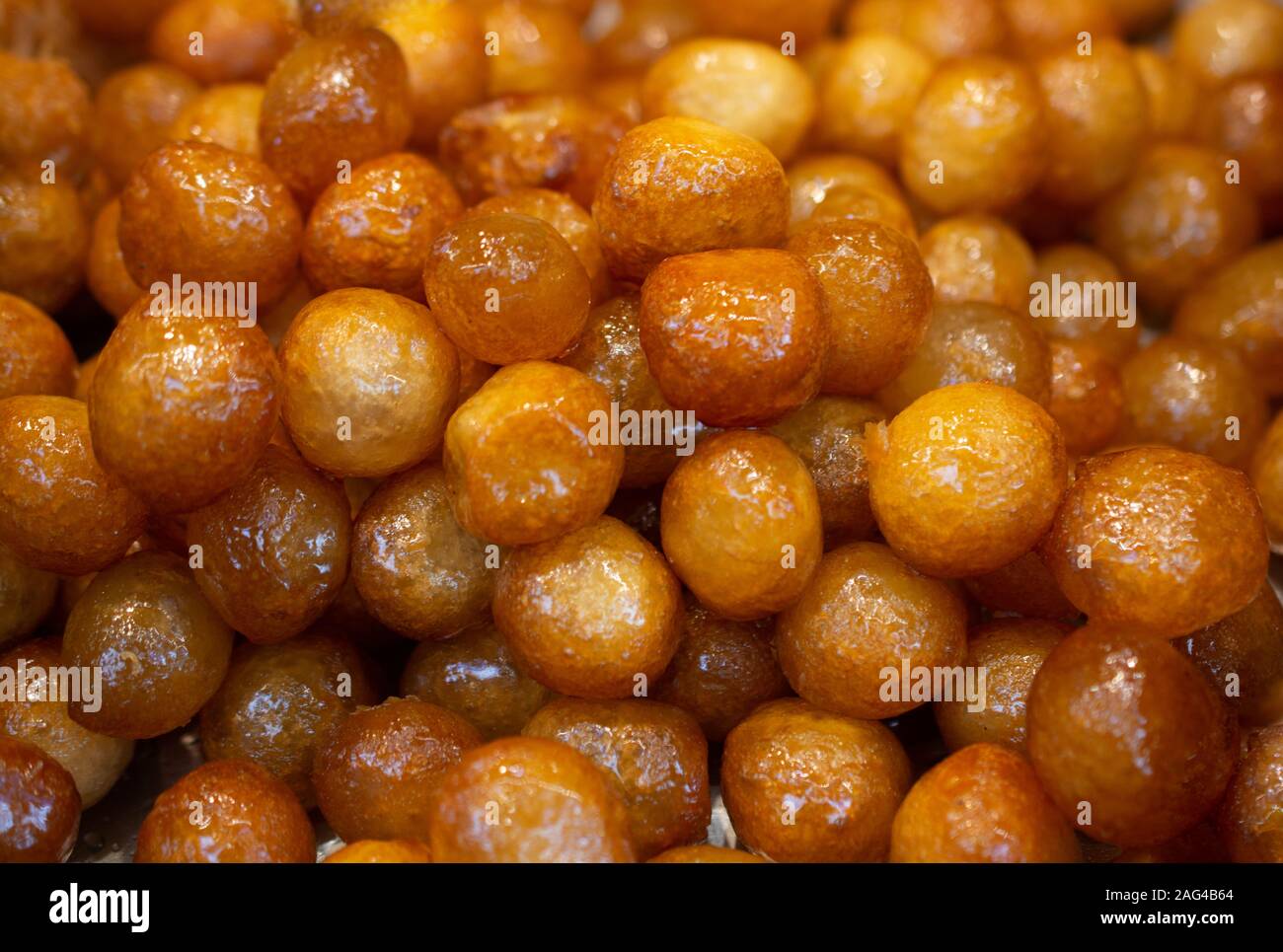 "Lokma" dessert; Traditional Turkish Lokma dessert fryied in oil and ...