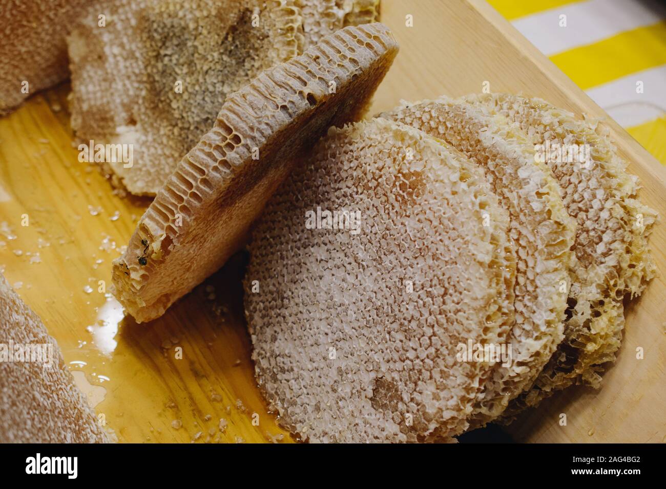 Honey in honeycomb from round beehive with sweet honey Stock Photo - Alamy