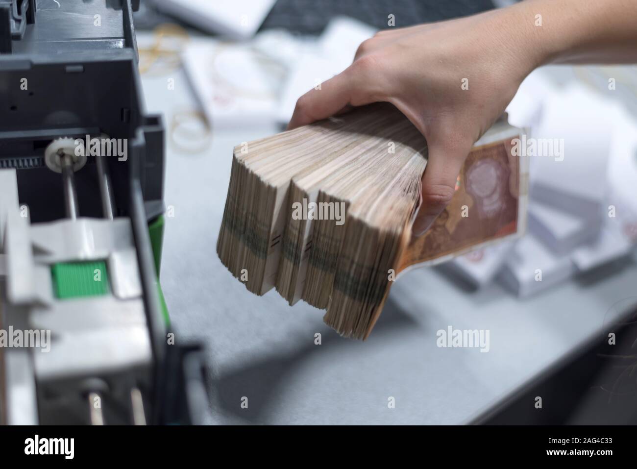 Bank employees sorting and counting money inside bank vault Stock Photo ...