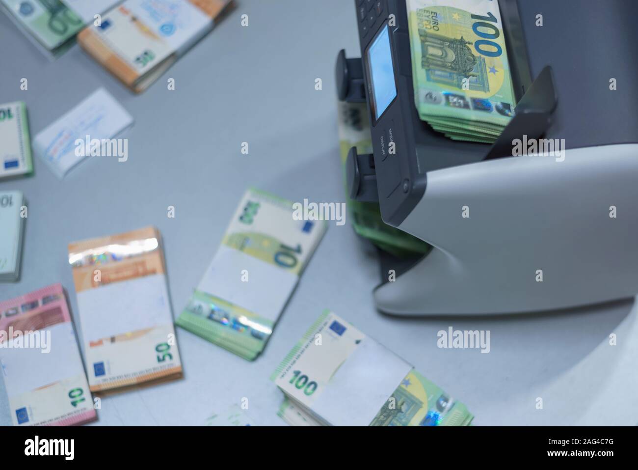 Bank employees sorting and counting money inside bank vault Stock Photo ...