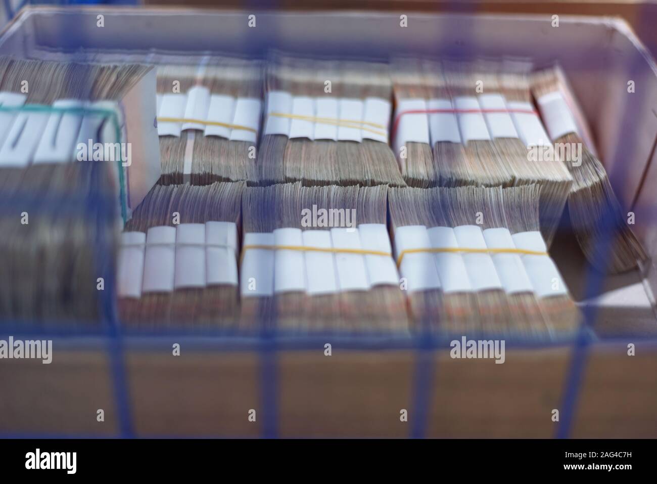 Bank employees sorting and counting money inside bank vault Stock Photo ...