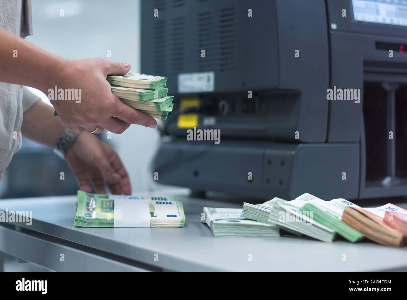 Bank employees sorting and counting money inside bank vault Stock Photo ...