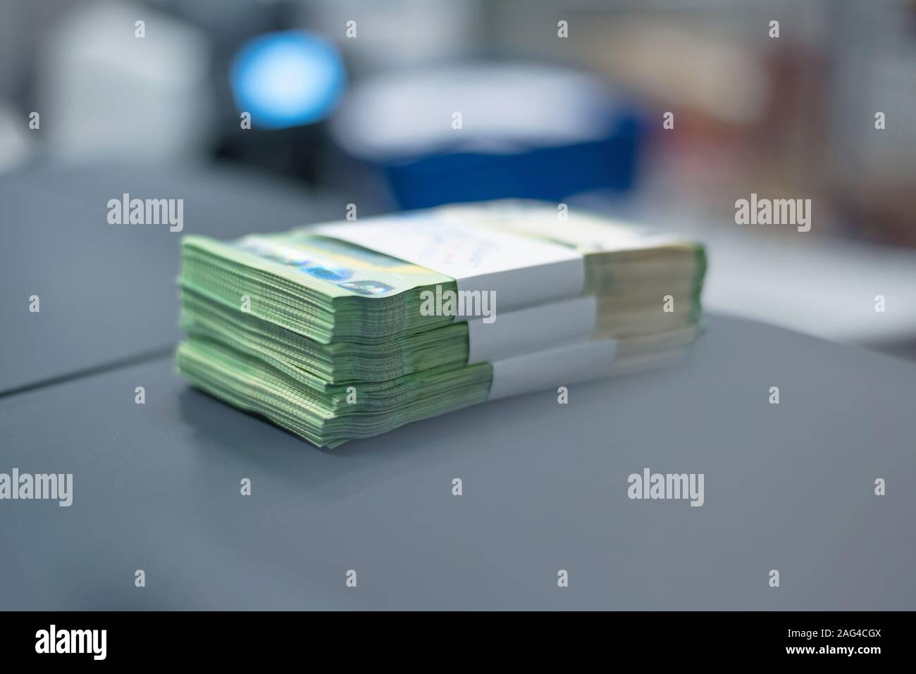 Bank employees sorting and counting money inside bank vault. Large ...