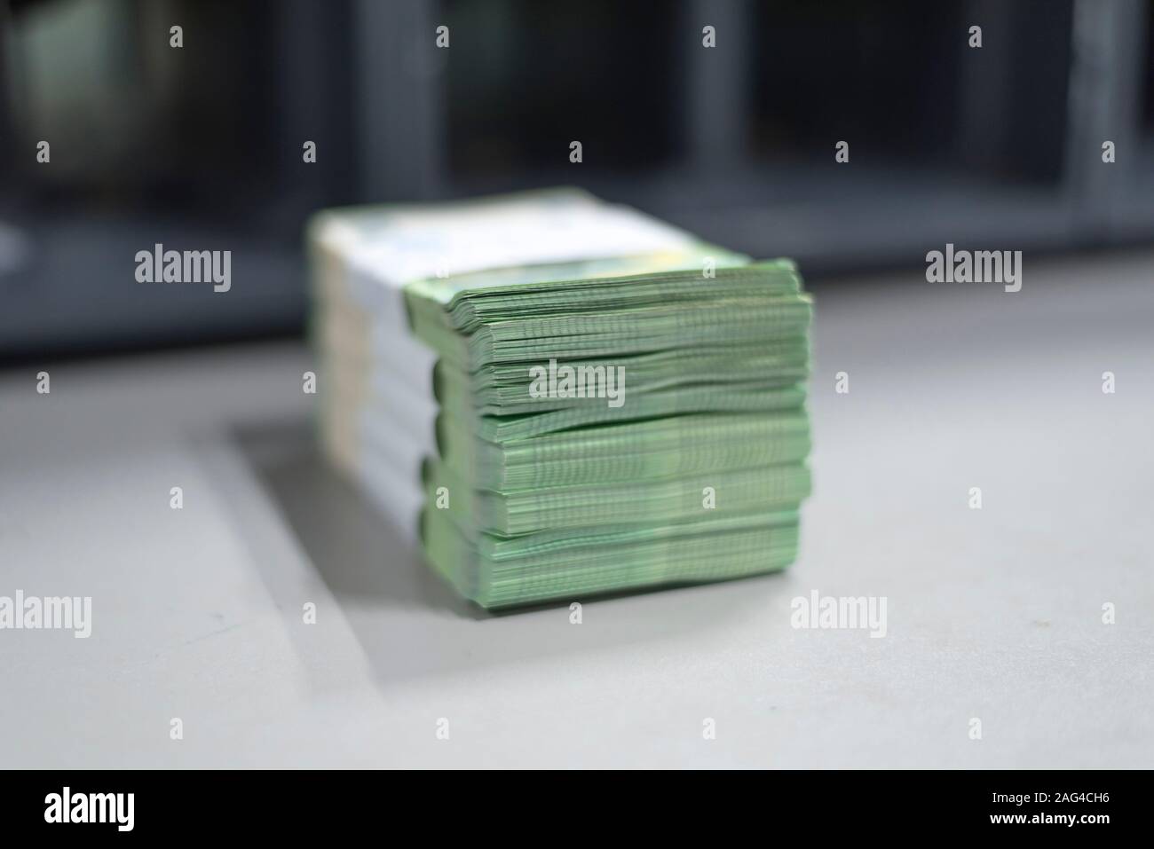 Bank employees sorting and counting money inside bank vault. Large ...