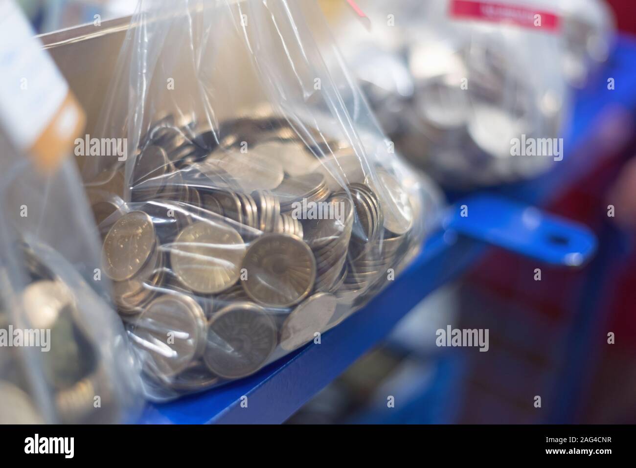Bank employees sorting and counting money inside bank vault. Large ...