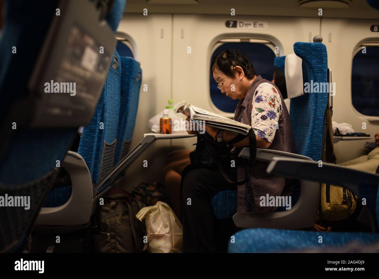 Elderly woman in train, Tokyo, Jana Stock Photo - Alamy