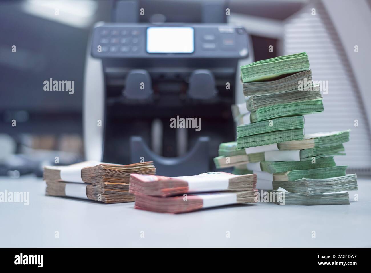 Bank employees sorting and counting money inside bank vault. Large ...