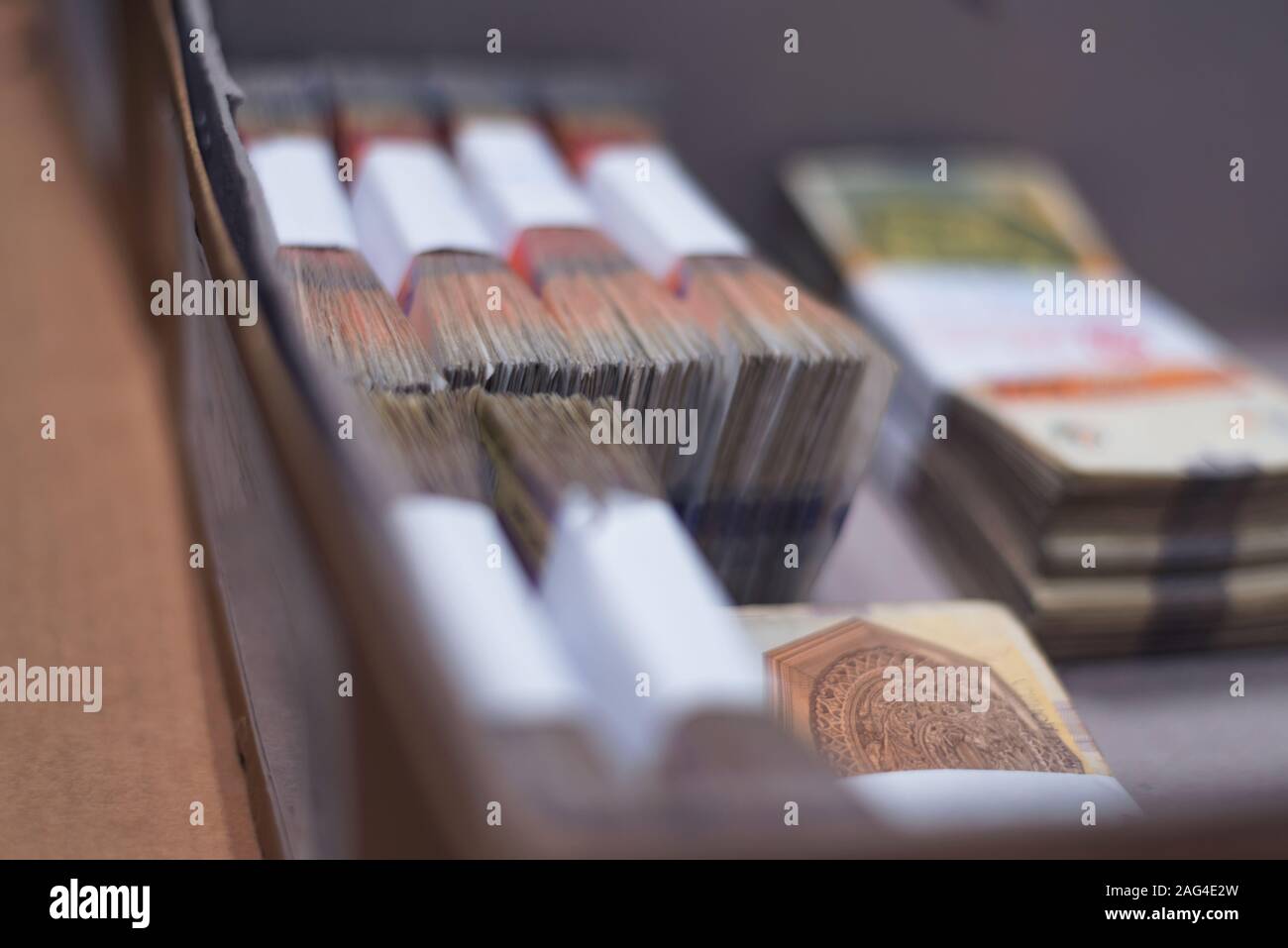 Bank employees sorting and counting money inside bank vault. Large ...