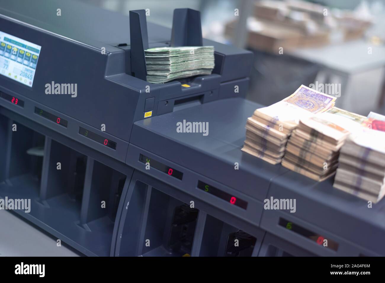 Bundles of banknotes divided into groups with currency straps placed on ...