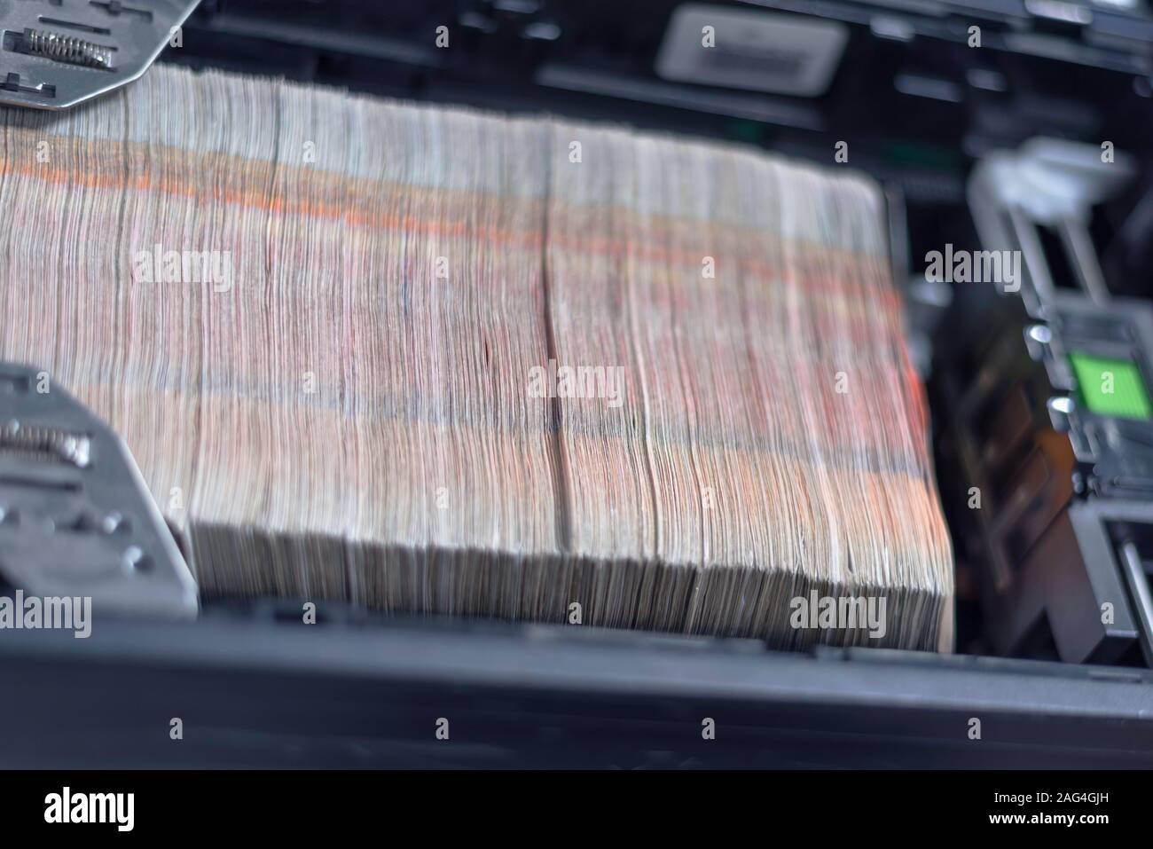 Carton boxes filled with sorted money and stored in a cage in the ...