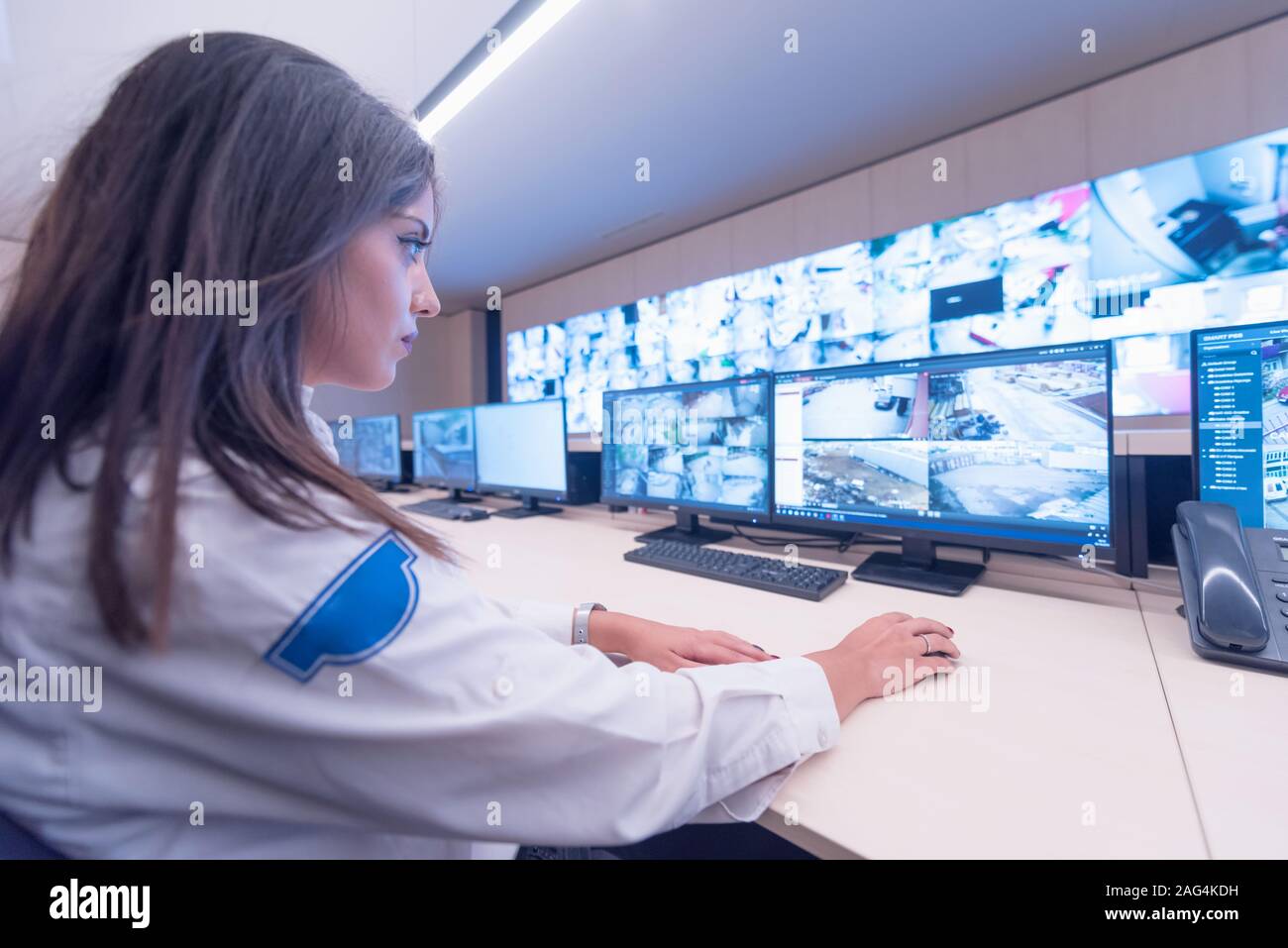 Security guard monitoring modern CCTV cameras in surveillance room ...