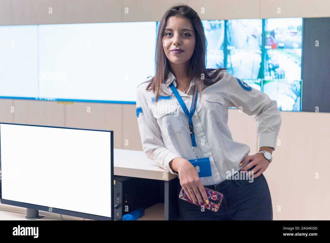 Security guard monitoring modern CCTV cameras in surveillance room ...
