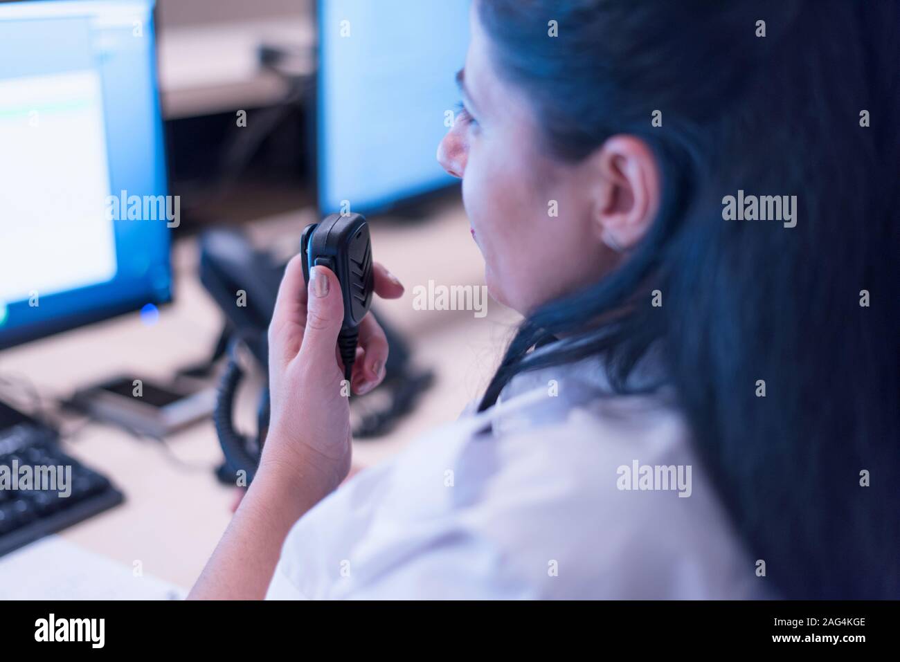 Security Guard Monitoring Modern Cctv Cameras In Surveillance Room